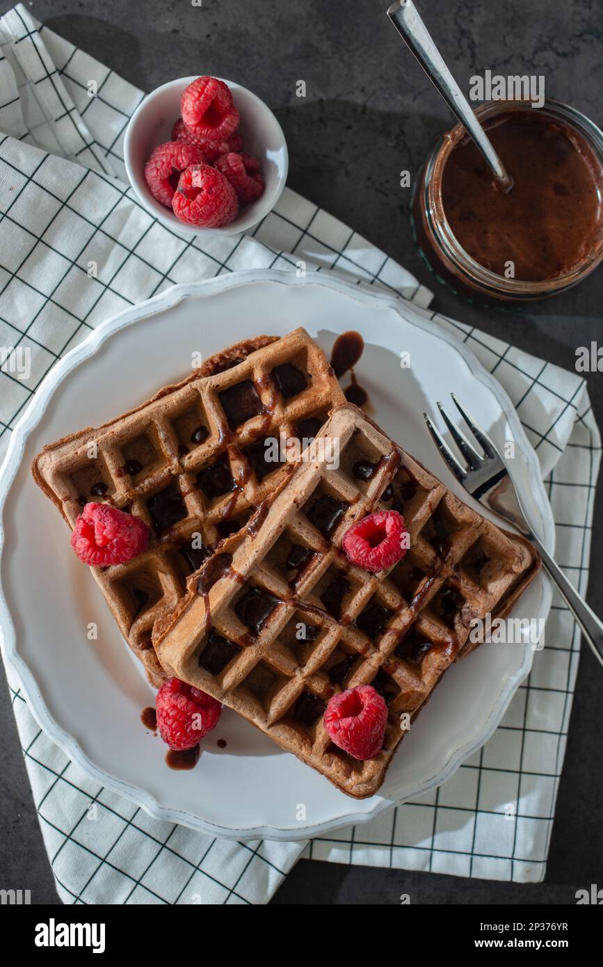sweet home made chocolate waffles with raspberries Stock Photo - Alamy