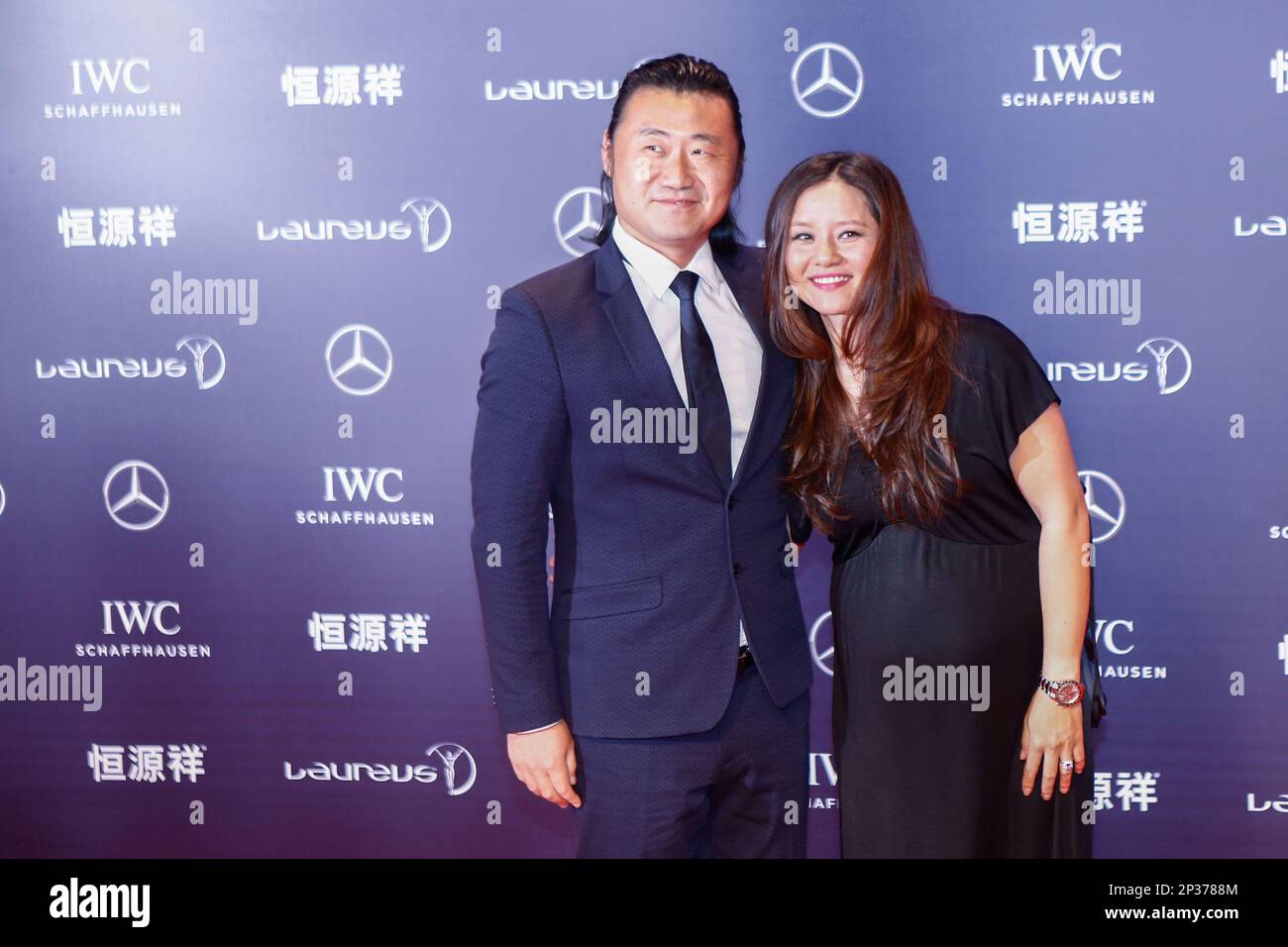 Pregnant Chinese tennis star Li Na, right, and her husband Jiang Shan ...