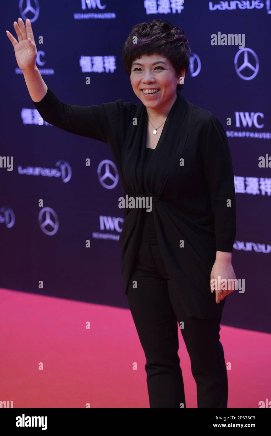Former Chinese table tennis world champion Deng Yaping poses on the red ...