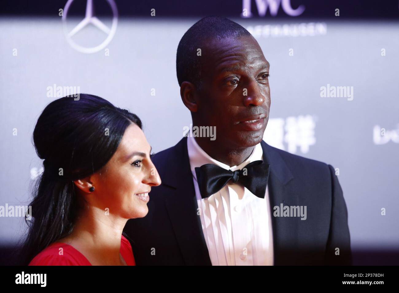 Retired Chinese sprinter Michael Johnson, right, and his wife Armine ...