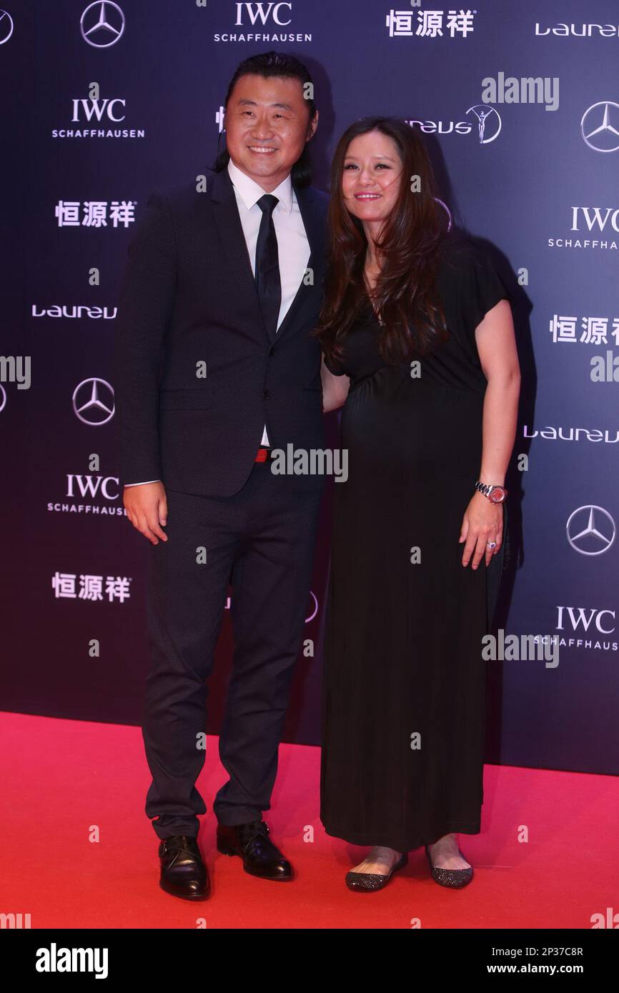Retired Chinese tennis star Li Na, right, and her husband Jiang Shan ...