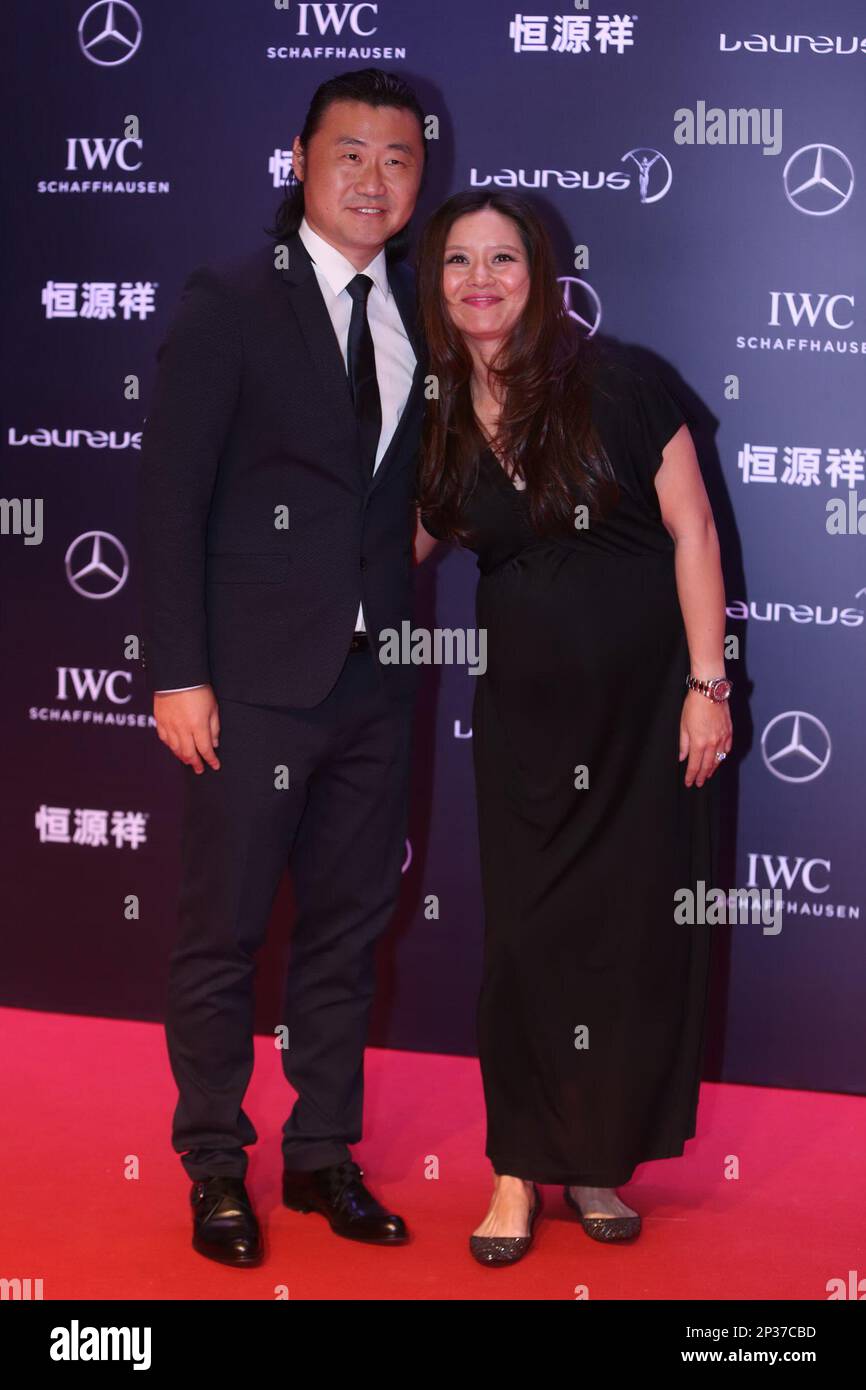 Retired Chinese tennis star Li Na, right, and her husband Jiang Shan ...