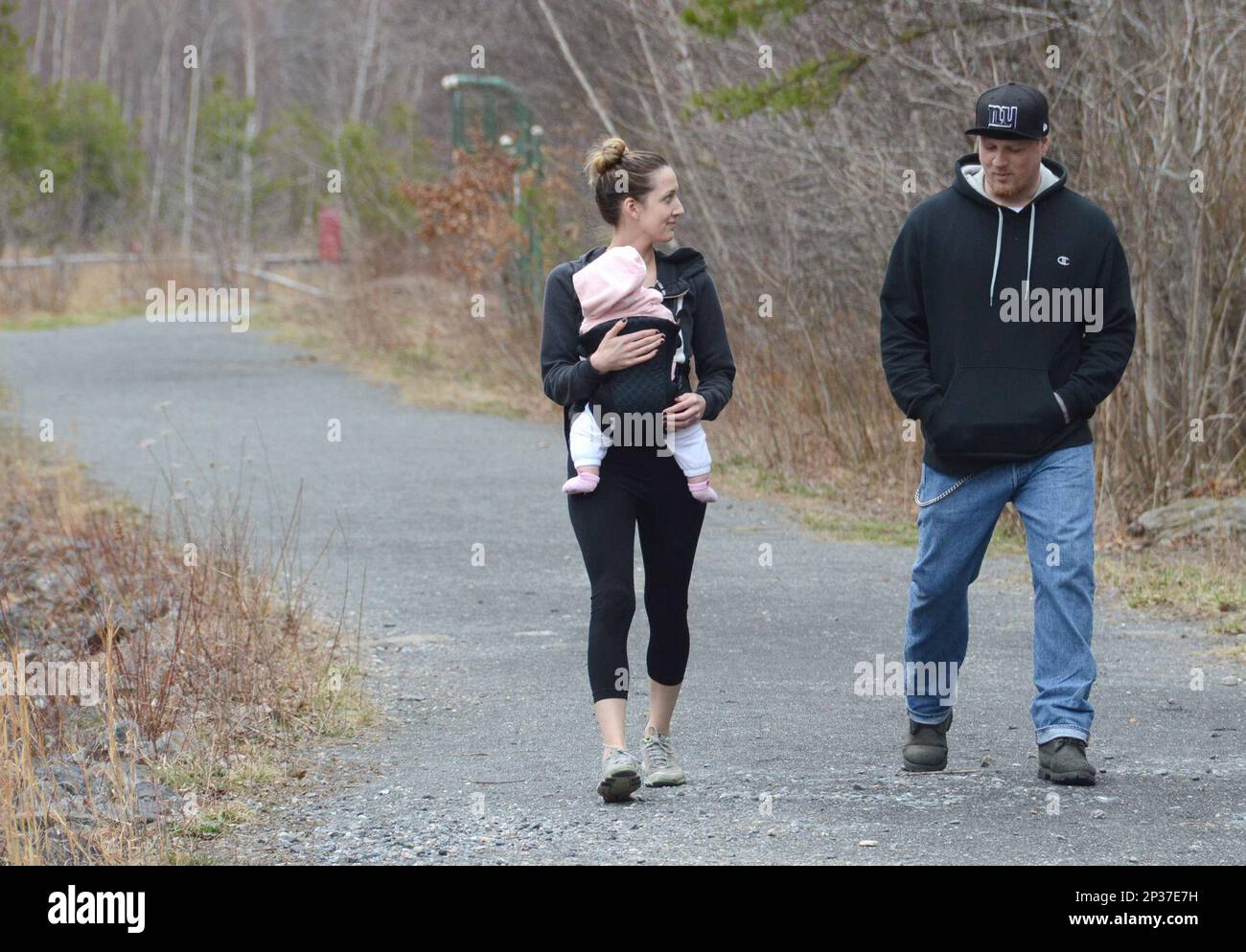Brooke Smith and Brad Somers, both of Hazleton, Pa., walk with their ...