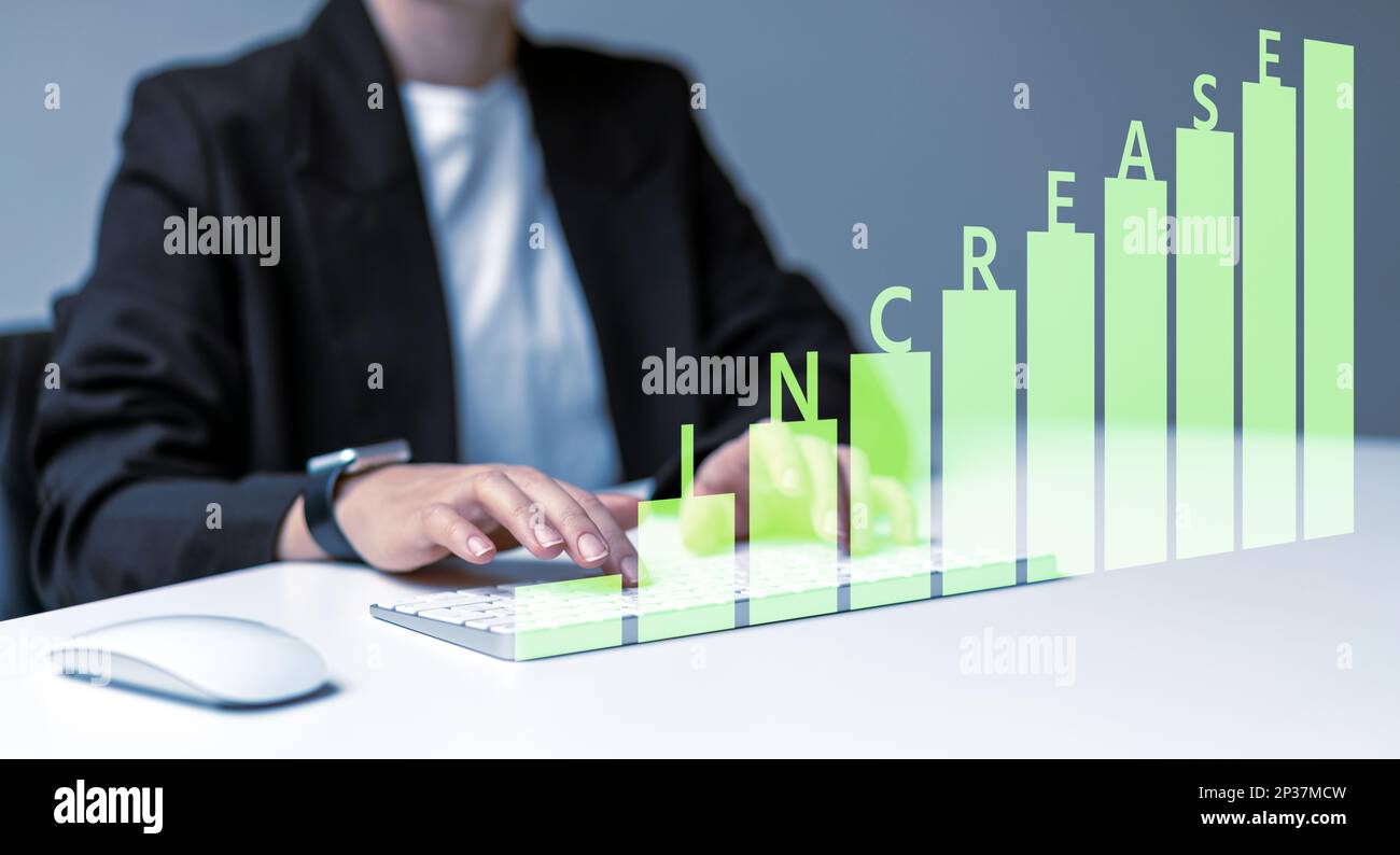 Green chart and word Increase, business person working on computer ...