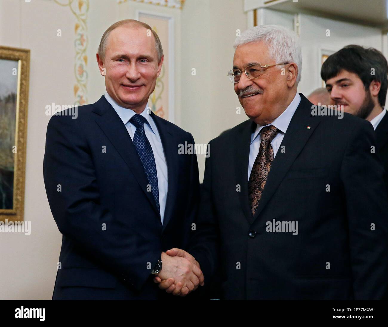 Russian President Vladimir Putin, left, shakes hands with Palestinian ...