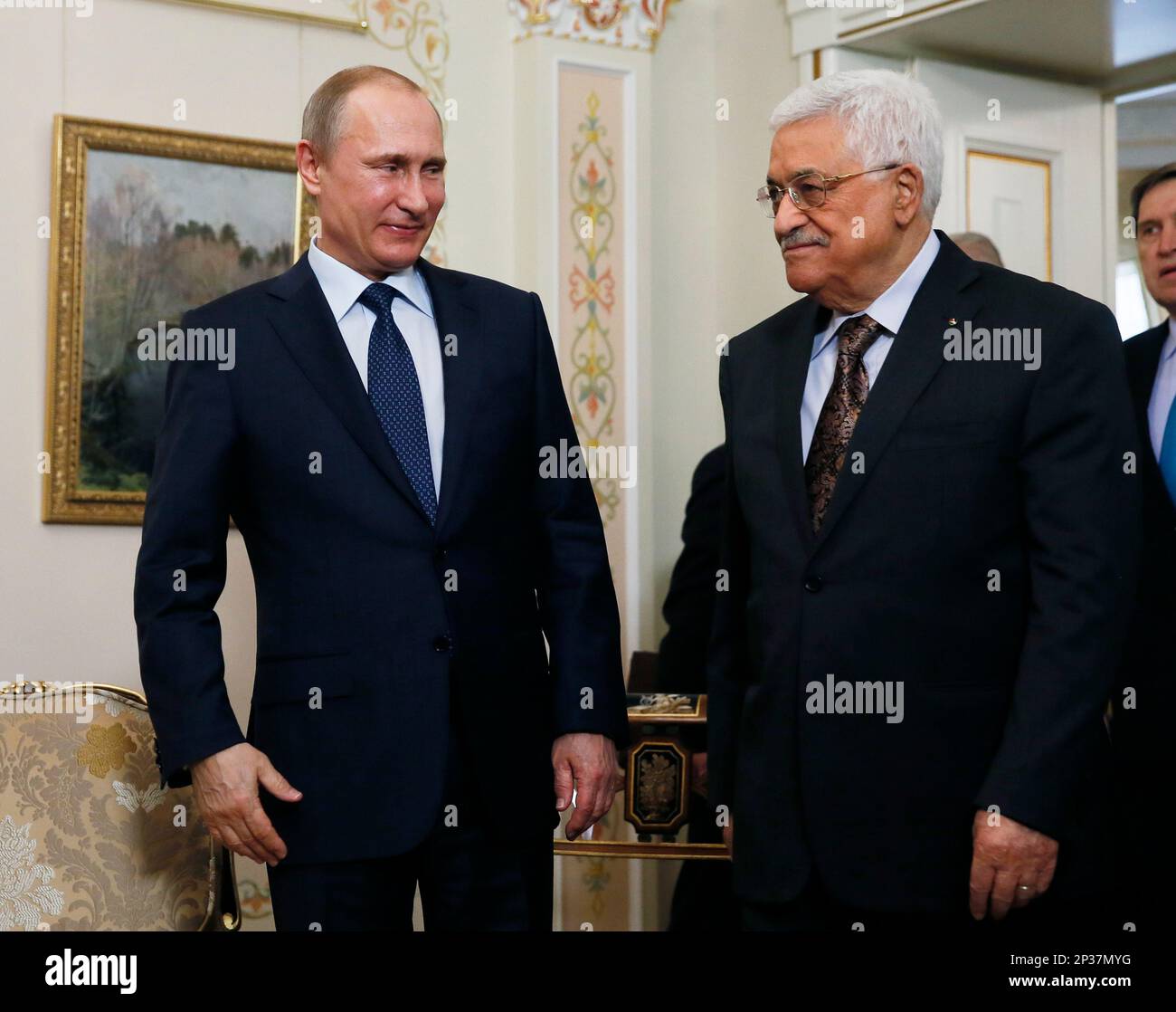 Russian President Vladimir Putin, left, shakes hands with Palestinian ...