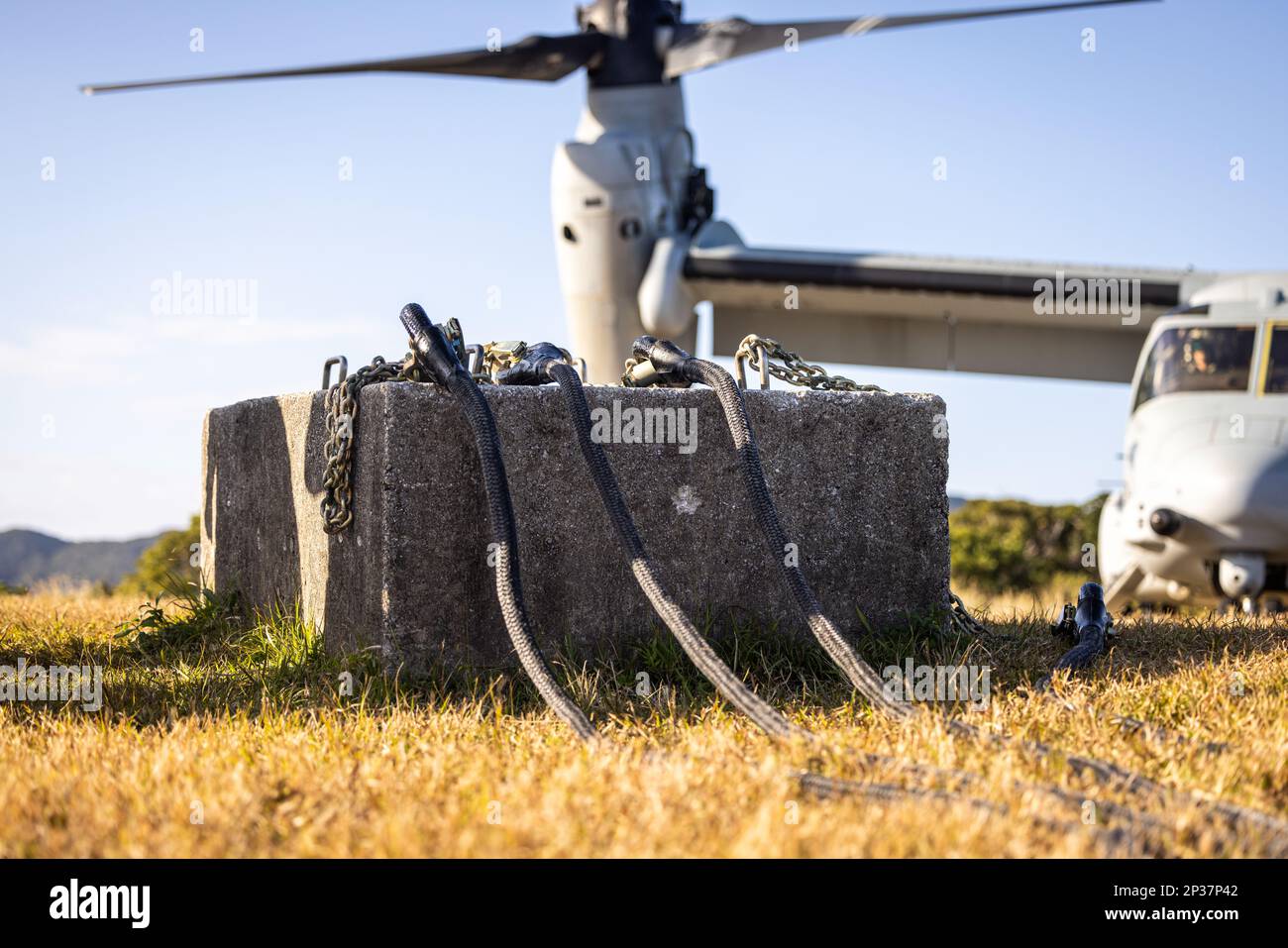 A concrete block is staged for an external lift at a landing zone in ...