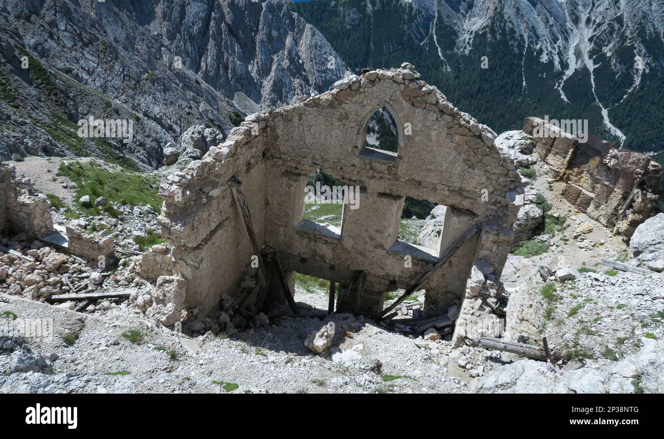 An old, destroyed building standing near the trail in the Dolomites ...