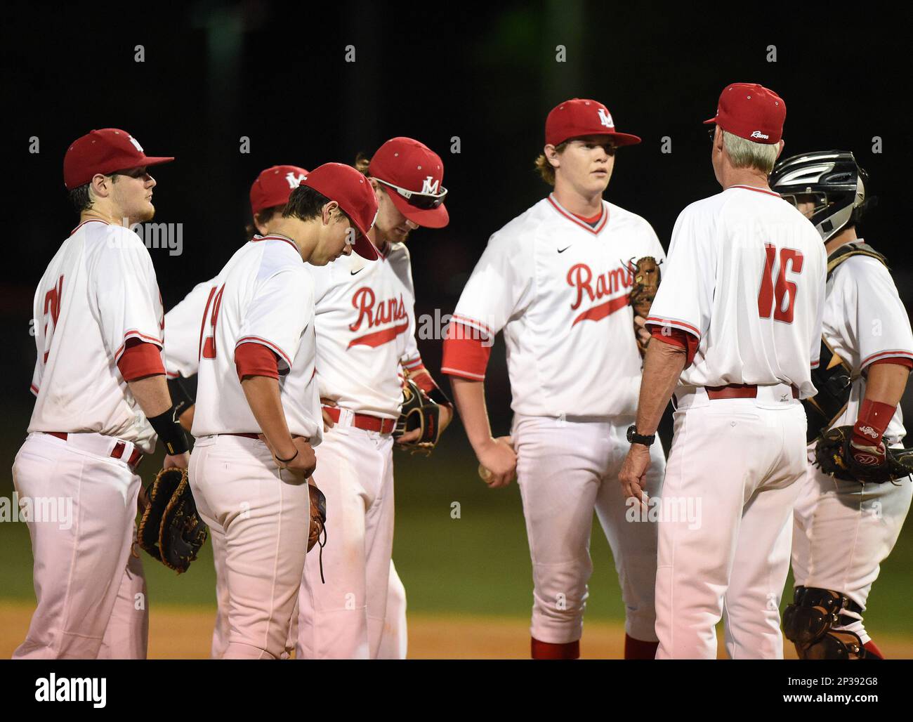 Lake Mary Rams coach Ed Nuss (16) talks with the team including (L-R ...