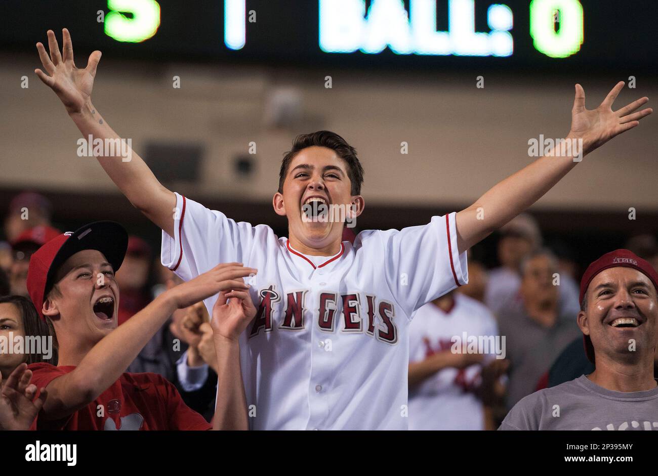 An Angel fan celebrates getting on the big screen during the Halos' 3-2 ...