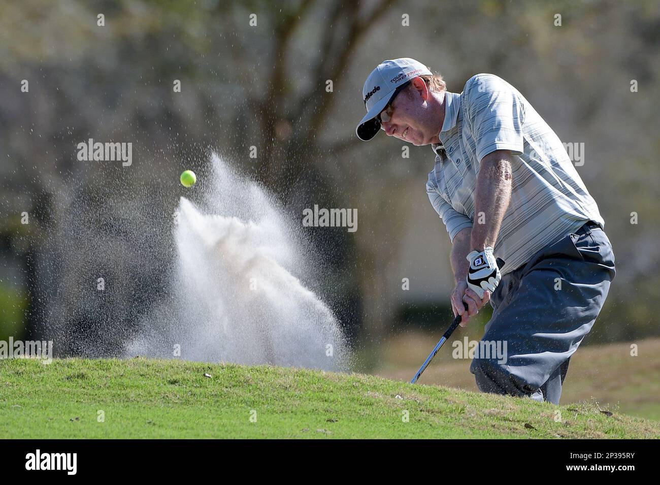 Paul Claxton hits onto the 17th green from a bunker during a Sunbelt ...