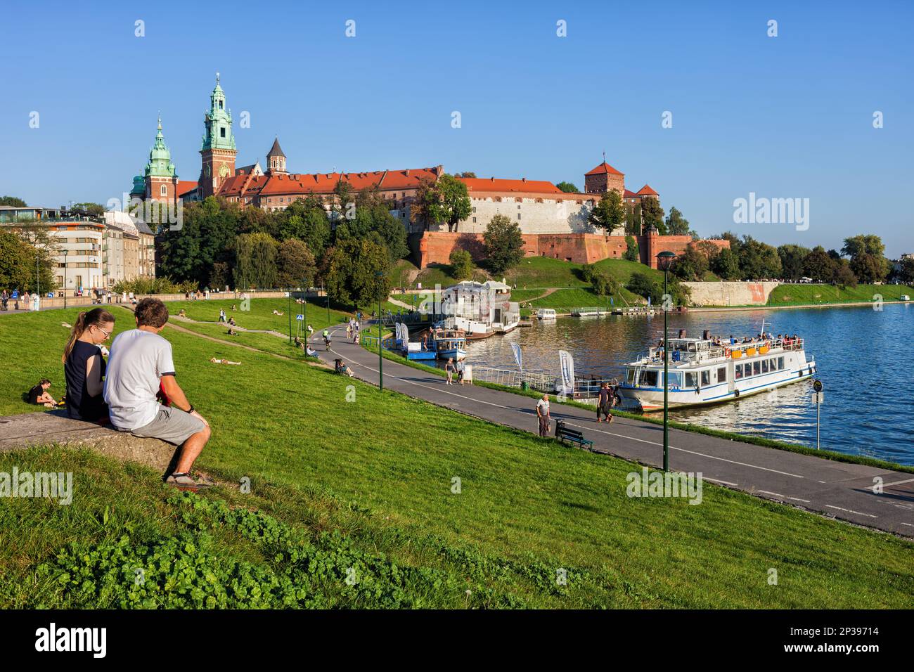 City of Kraków (Cracow) in Poland, people enjoy the view of the Wawel ...