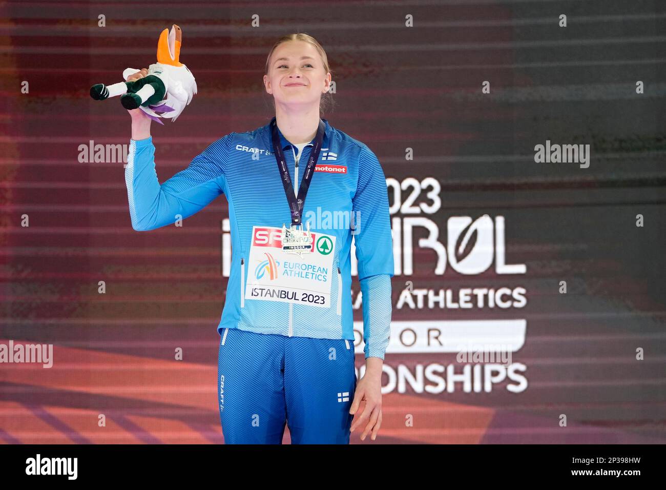 Wilma Murto, of Finland, stands on the podium after winning the gold ...