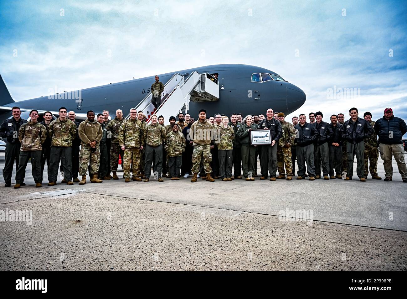 U.S. Air Force personnel assigned to the 305th Air Mobility Wing pose ...
