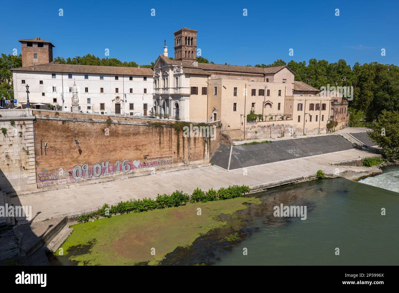 Italy, Rome, buildings on Tiber Island with Basilica of St. Bartholomew ...
