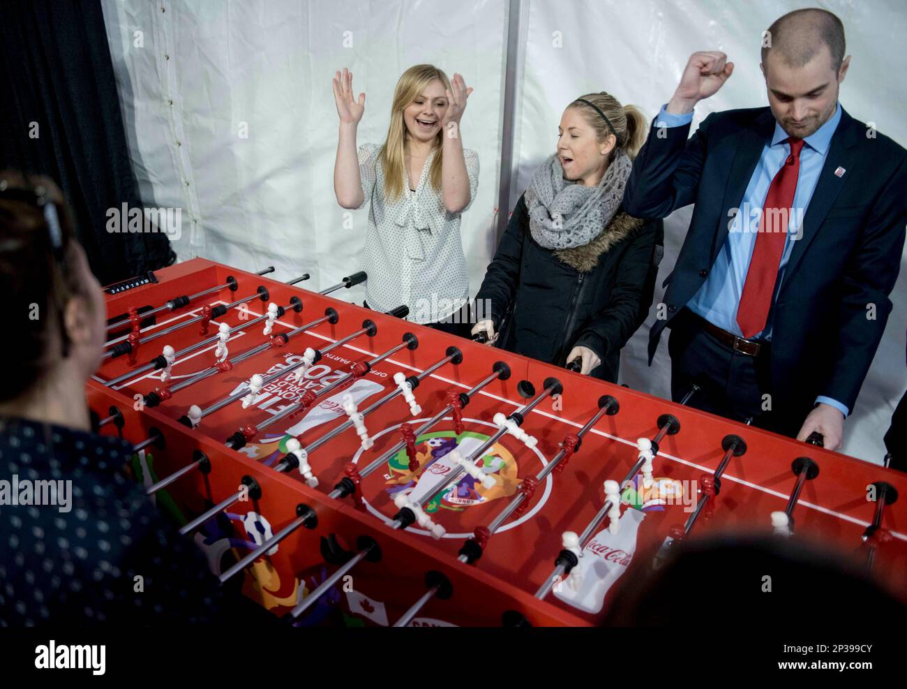 Sally Taylor-Isherwood, left, Jen McKee and Jordan Carroll celebrate a ...