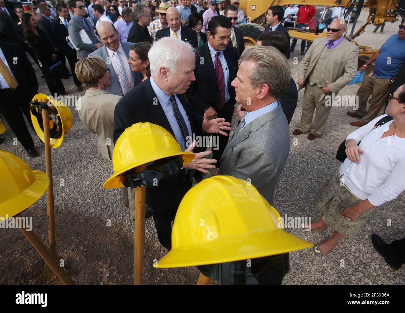 Arizona Sen. John McCain, left, talks with Raytheon Missile Systems ...