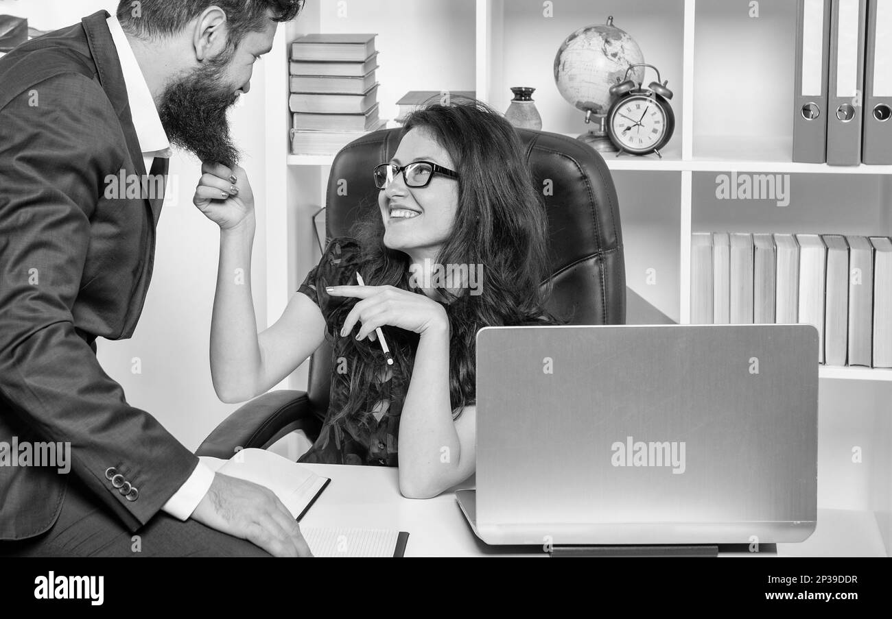 Keeping flirting at work. Assistant flirting with ceo. Happy woman pull ...