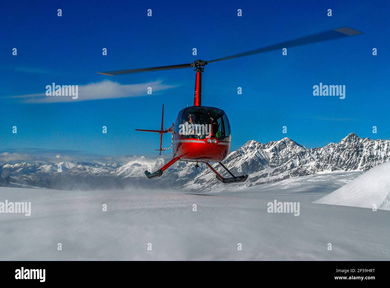 A Robinson R44 Clipper helicopter from Alpine Air Alaska landing in the ...