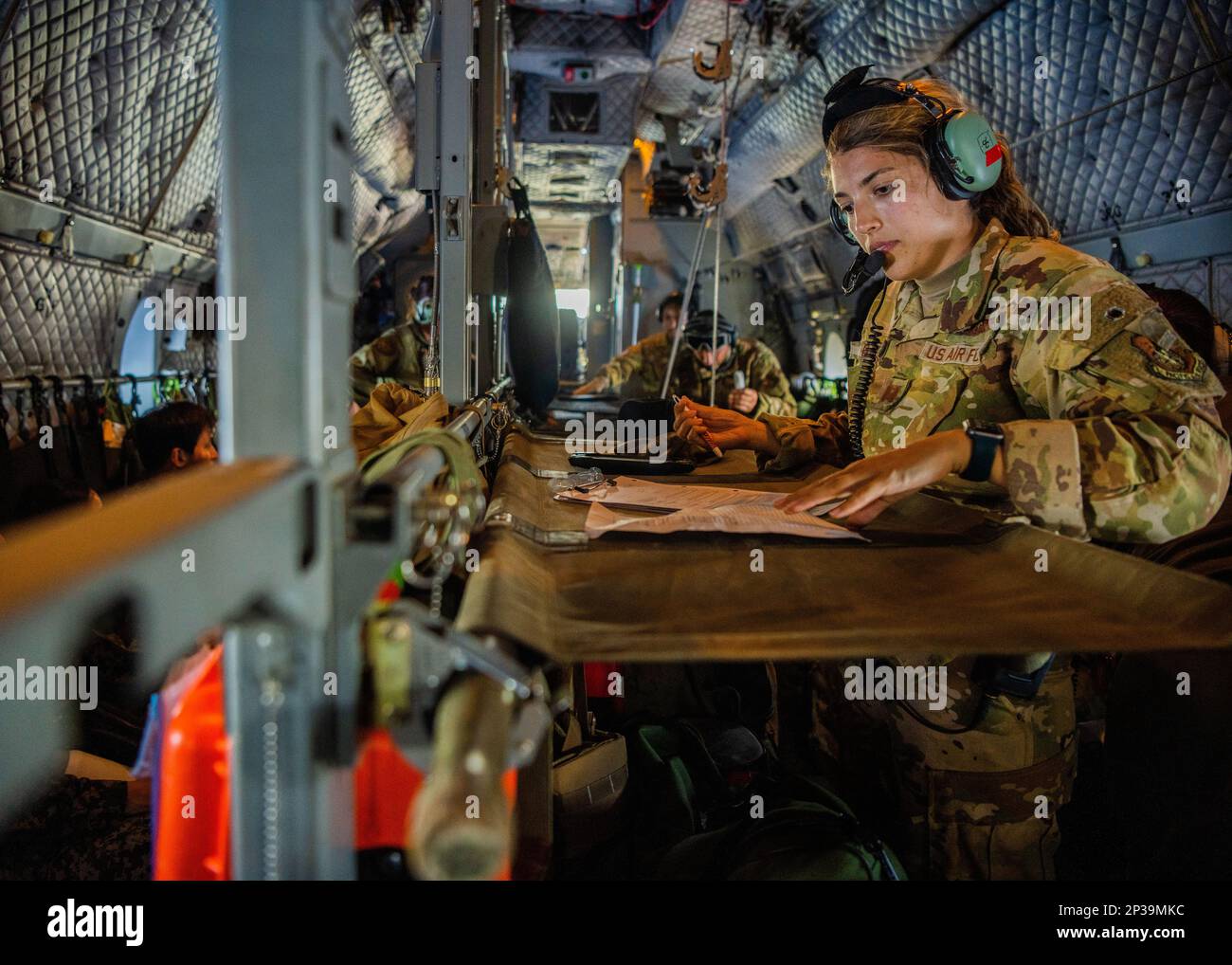 U.S. Air Force Capt. Shailey Dao, flight nurse, works inflight on a C ...