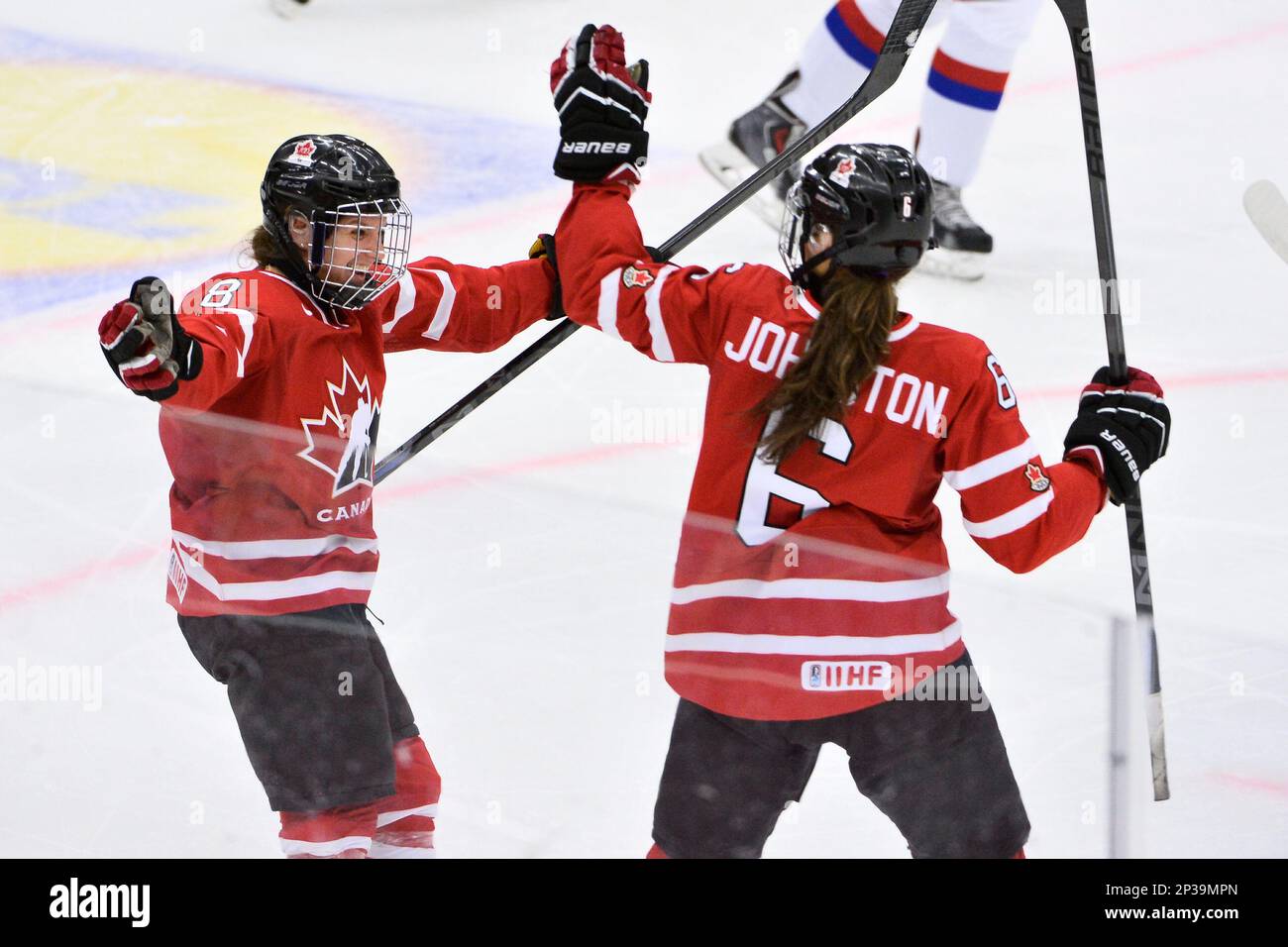 Canada's Laura Fortino, left, is congratulated by teammate Rebecca ...