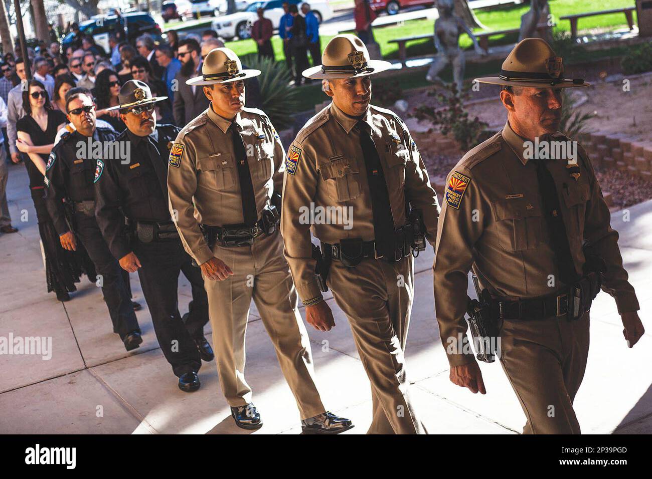 Law enforcement officers walk inside The Yuma Civic Center Saturday ...