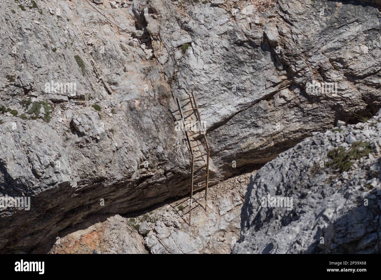 Elements set by man to facilitate the route via ferrata. Dolomites ...