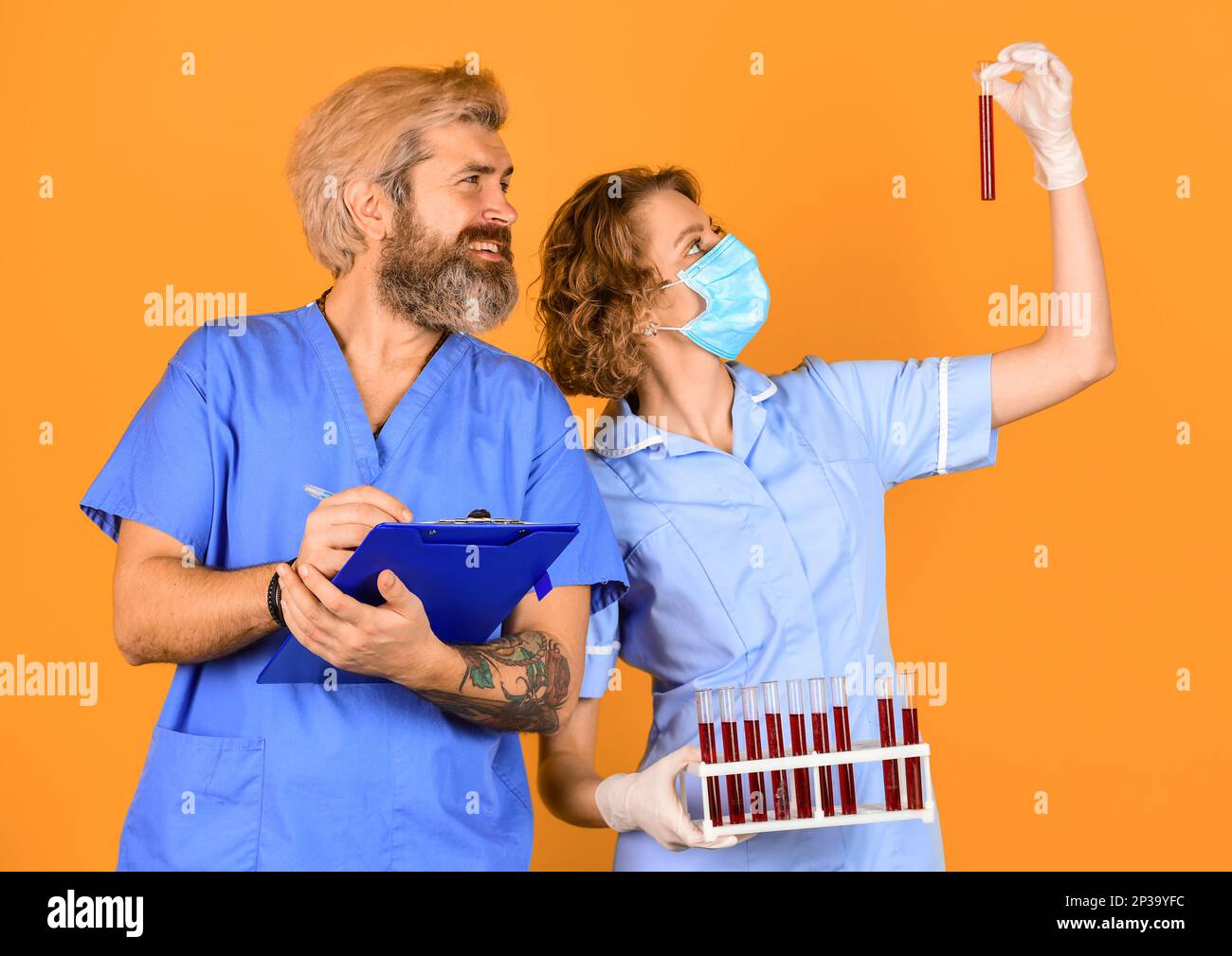 Good news. Blood samples. Virus remedy in lab. Doctors respirator mask ...