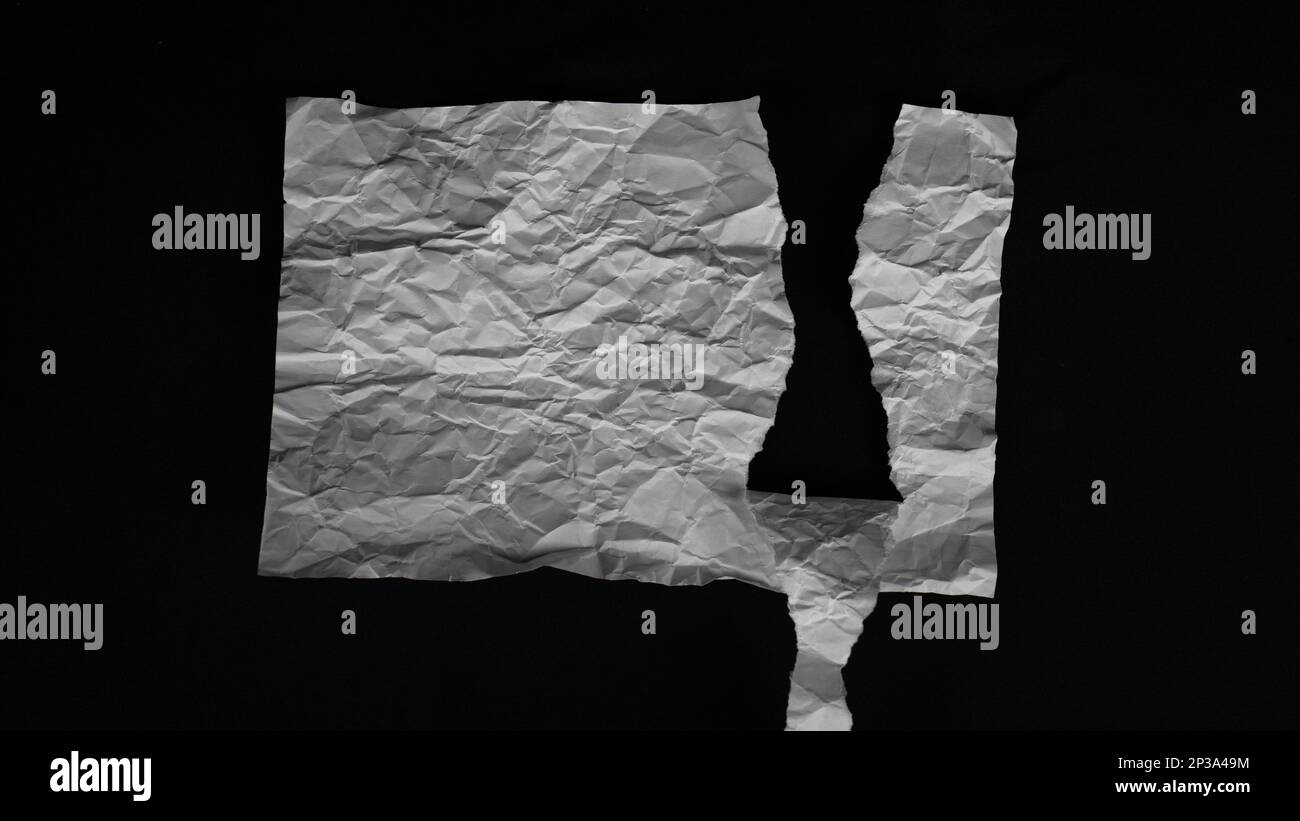 Torn paper. White and torn white a4 paper on black background Stock ...