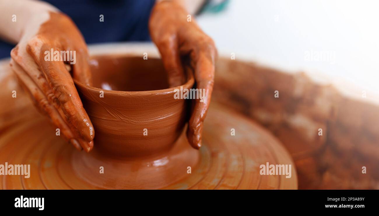 Master making a pot on pottery wheel,banner Stock Photo - Alamy
