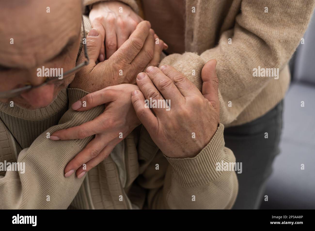 Two people holding hand together. elderly man and support woman Stock ...