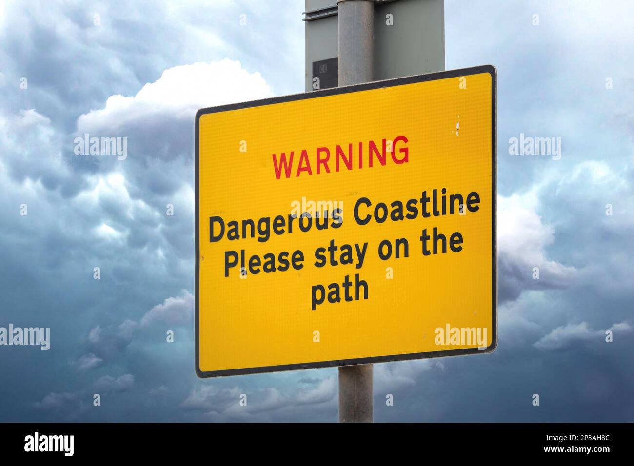 yellow warning sign, by the coast, at crosby, merseyside,dangerous ...