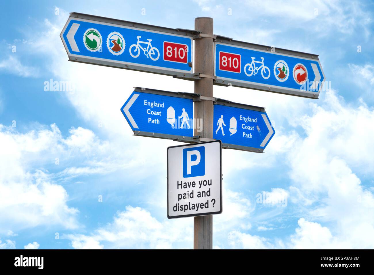 blue direction finger signs for england coastal path, cycle route 810 ...