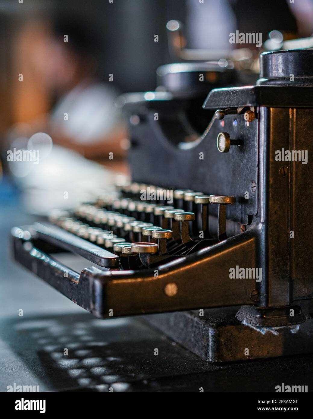 A detailed closeup of a brown antique typewriter with its keys exposed ...