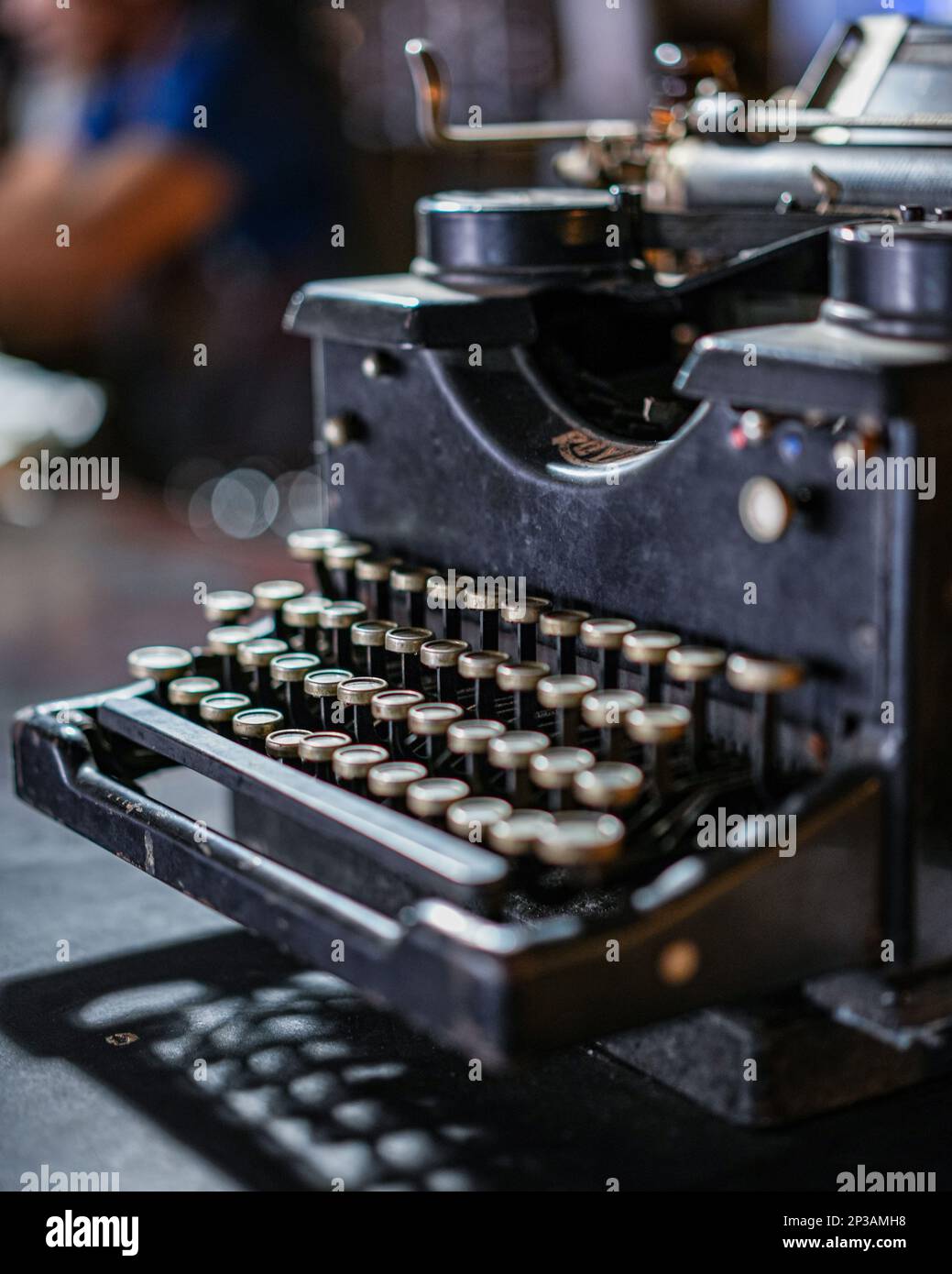 A detailed closeup of a brown antique typewriter with its keys exposed ...