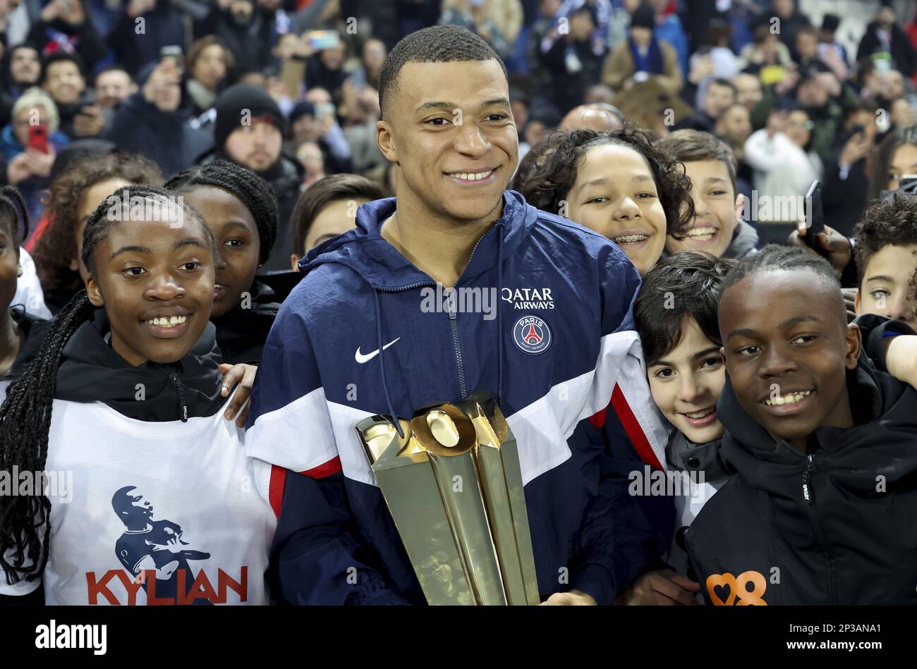 Kylian Mbappe of PSG receives a trophy celebrating his 201st goal for ...