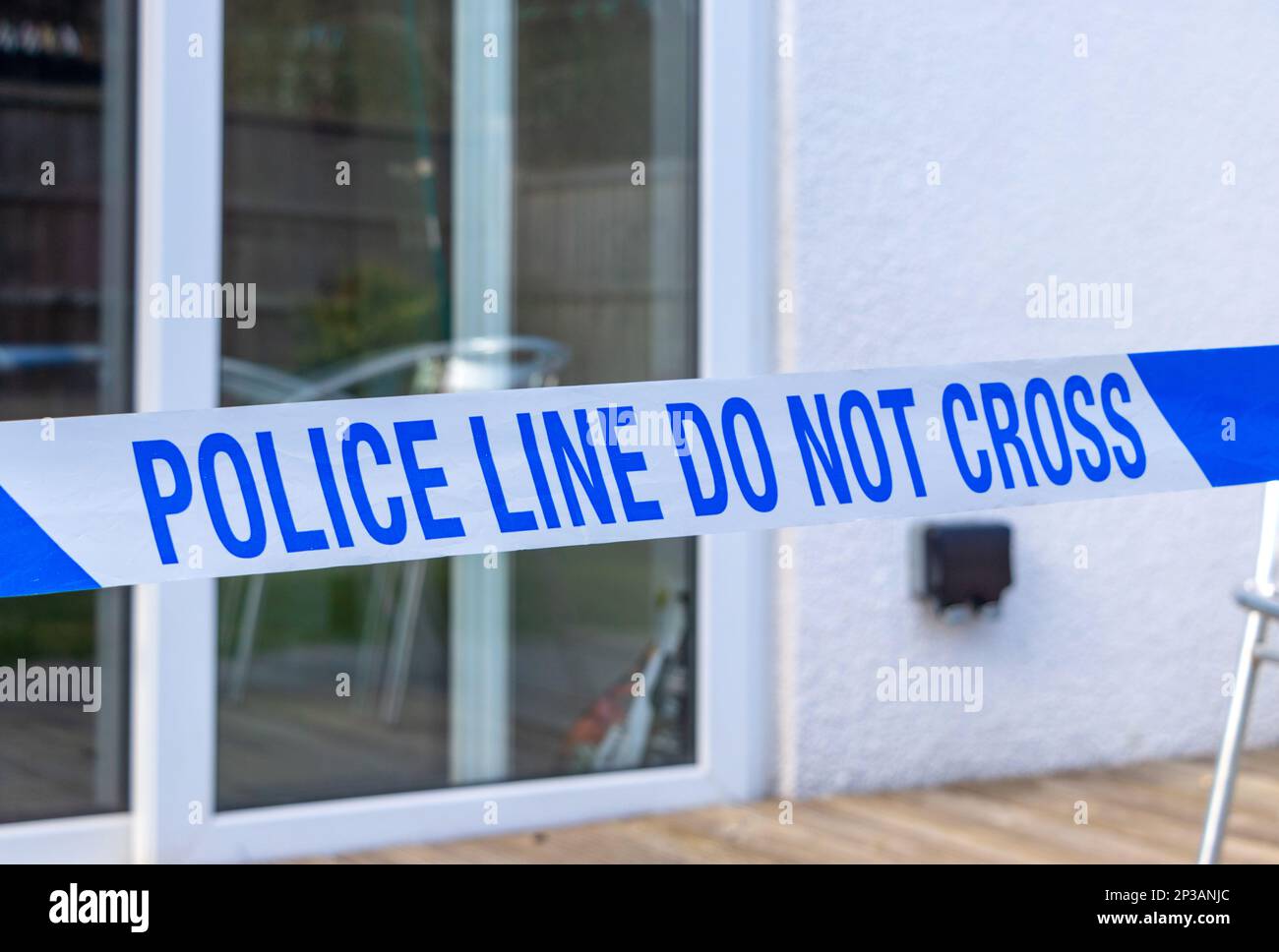 close up of police line do not cross tape at cordon around crime scene ...