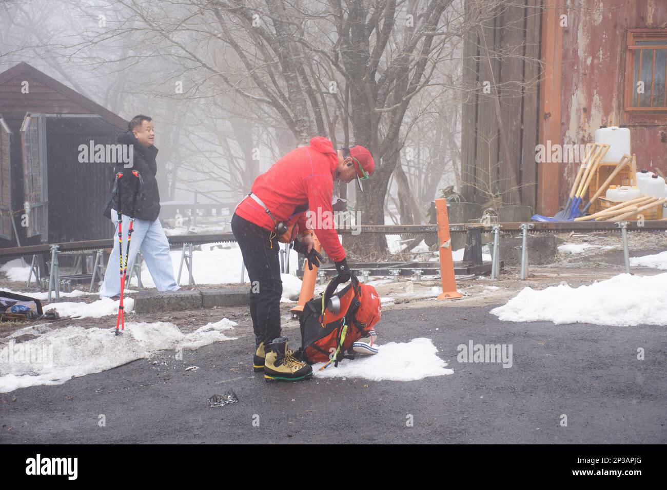 Korean hiker or trekker people walk trail hiking on snow falling ...