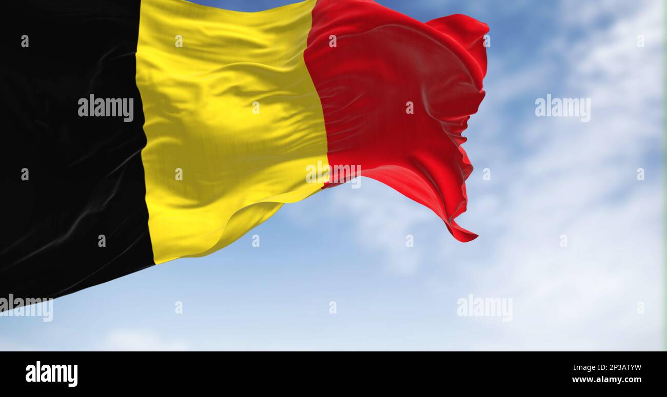 The national flag of Belgium waving on a clear day. Three equal ...