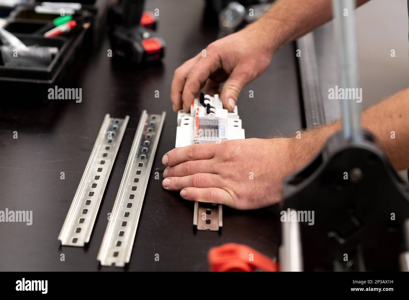 Electrician at work, electric components, electrical voltage ...