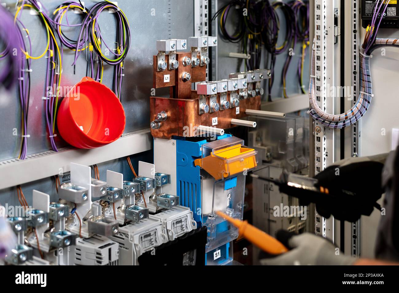 Electrician at work, electric components, electrical voltage ...