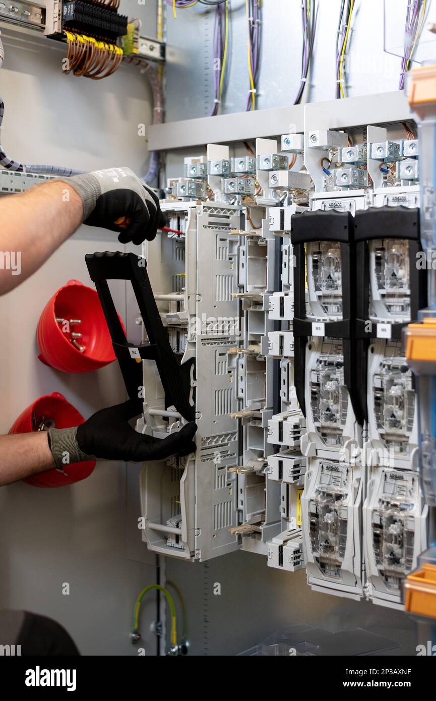 Electrician at work, electric components, electrical voltage ...