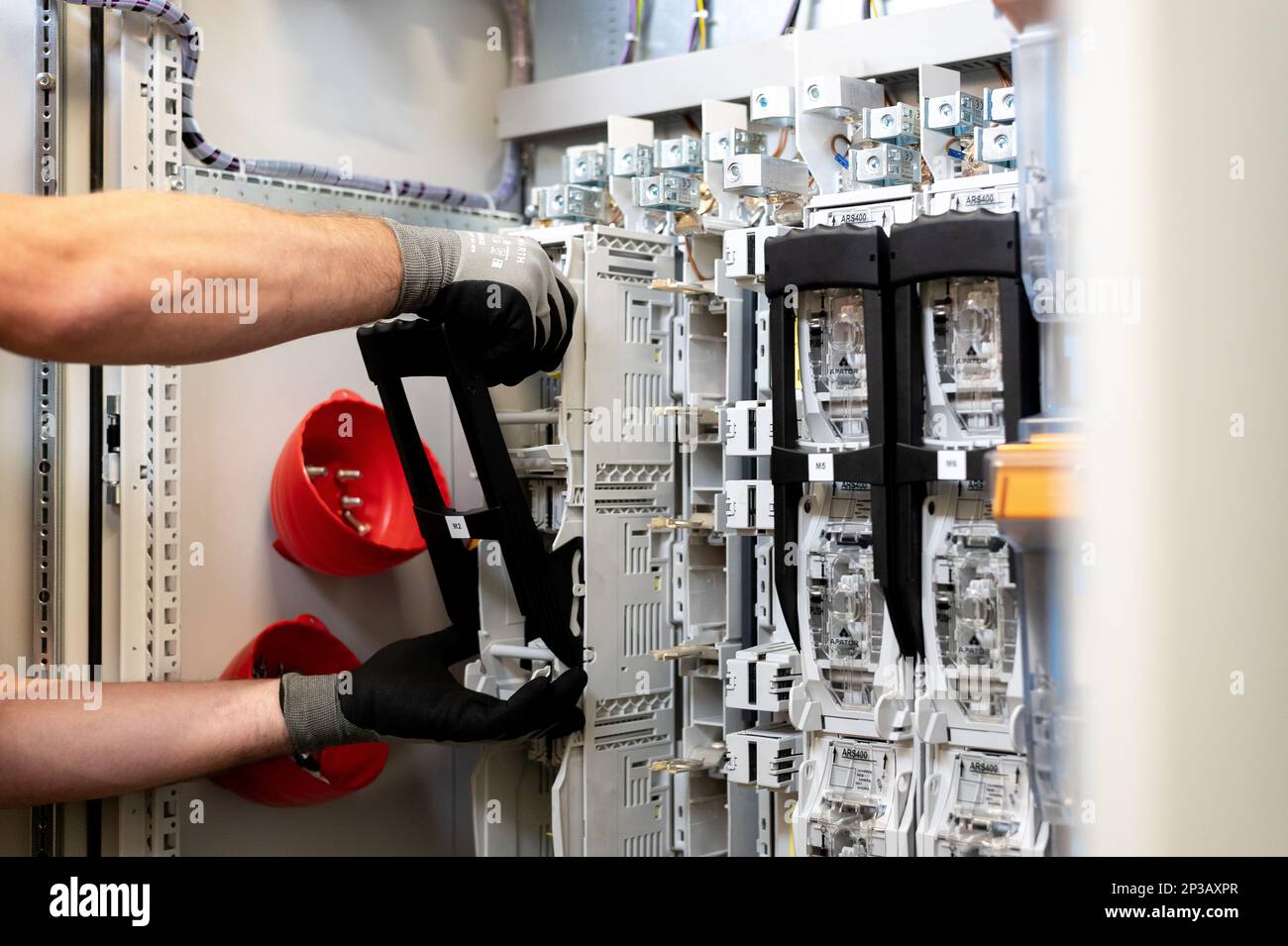 Electrician at work, electric components, electrical voltage ...