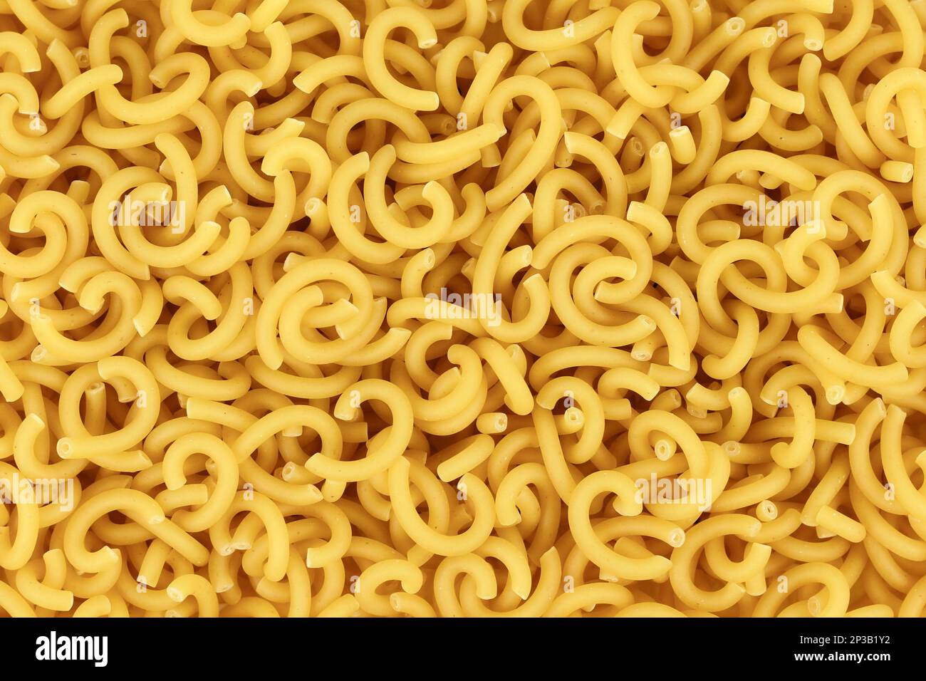 Top view of thin, twisted smooth and tube shaped 'Gramigna' pasta Stock ...