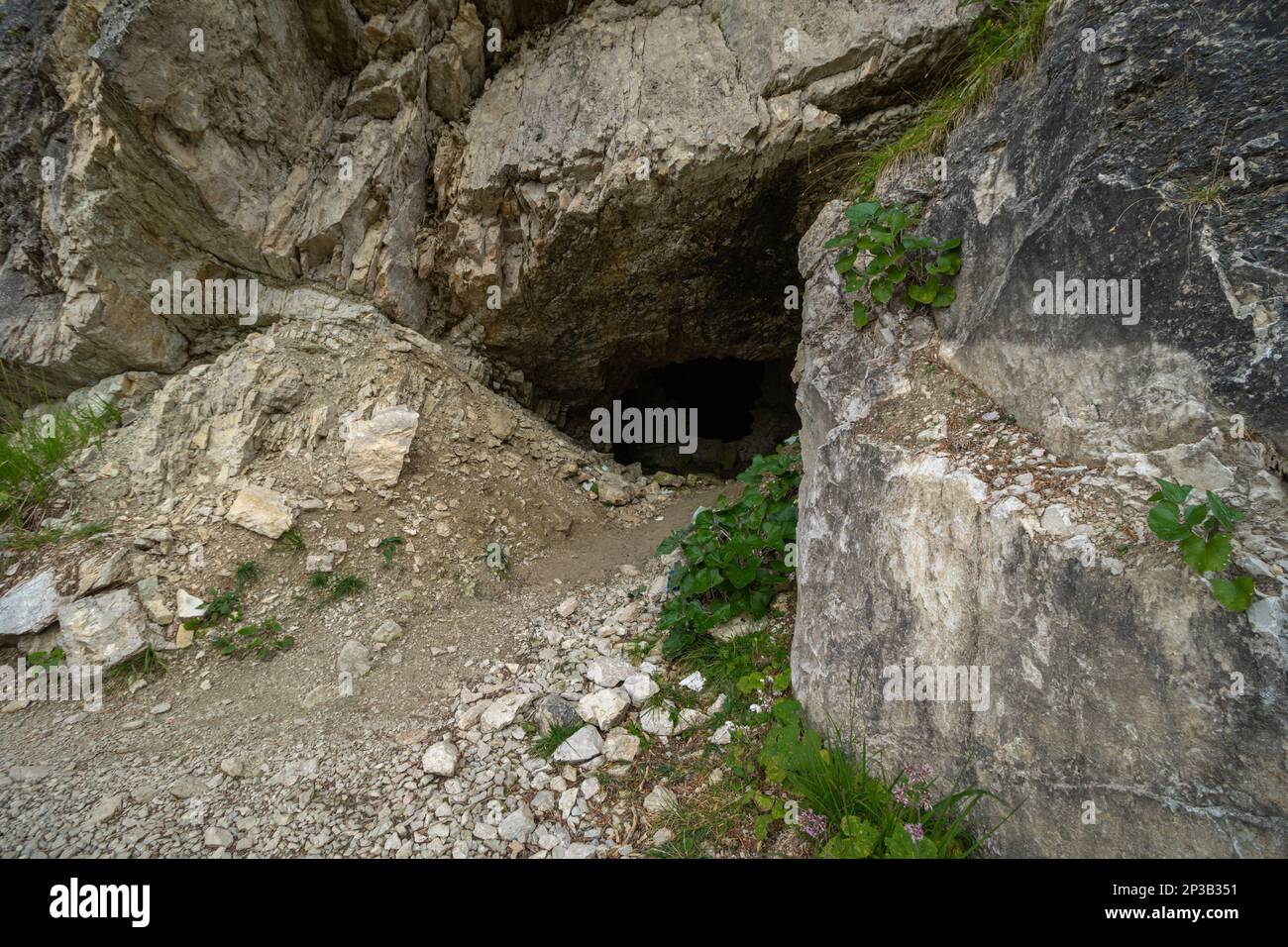 entrance to a small cave in the dolomites. Dolomites, Italy Stock Photo ...