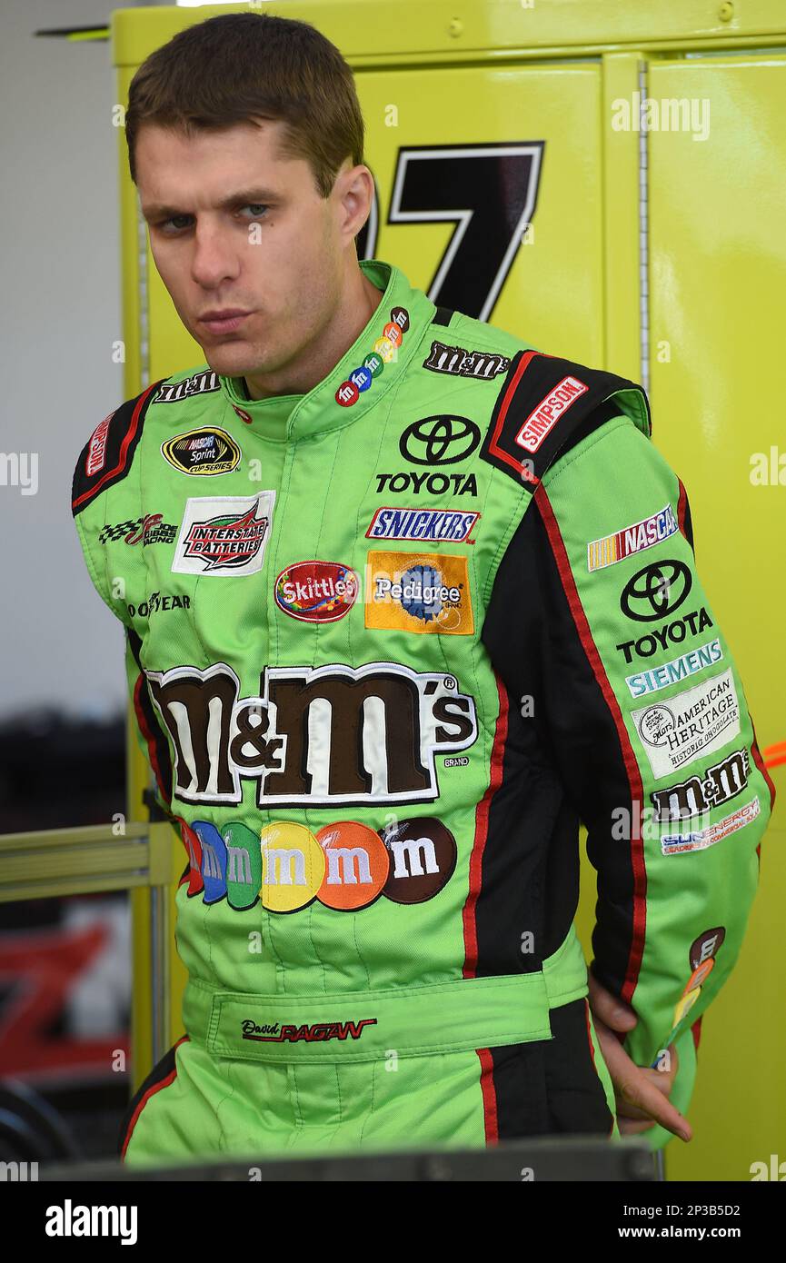 David Ragan, M&M's Crispy Toyota Camry (18) stands in the garage during ...