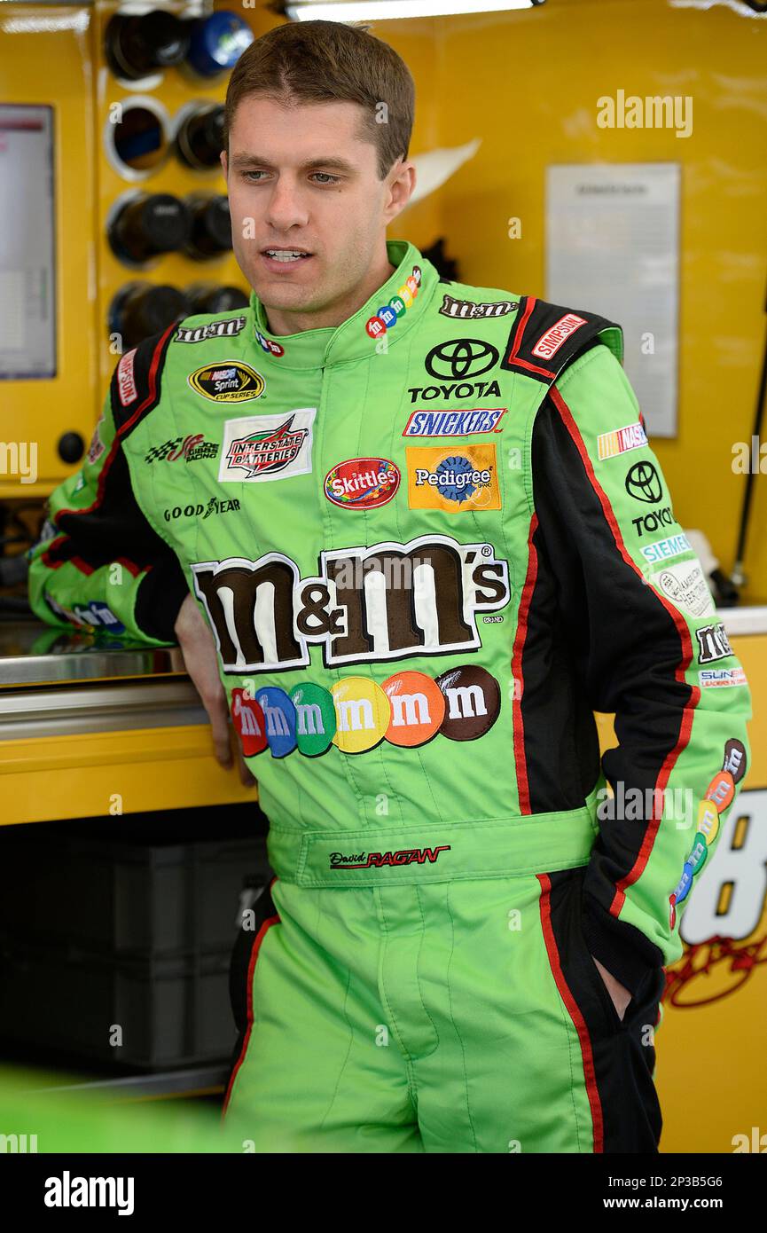 David Ragan, M&M's Crispy Toyota Camry (18) stands in the garage during ...
