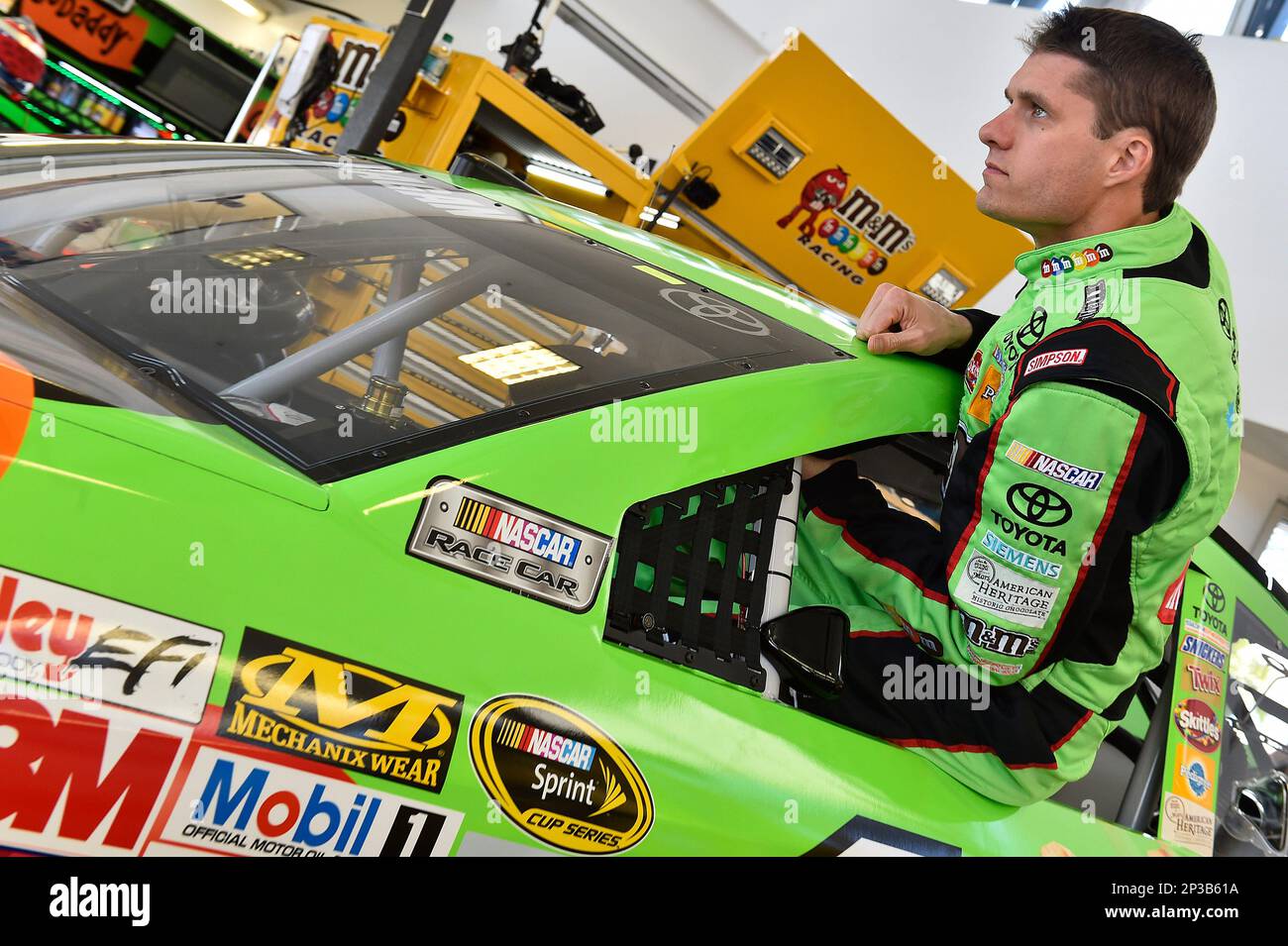 David Ragan, M&M's Crispy Toyota Camry (18) climbs into his car during ...
