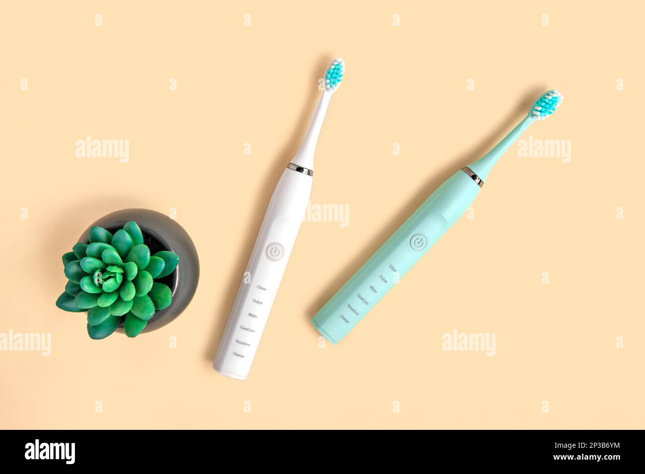 Toothbrushes on a beige neutral pastel color studio background. Top ...