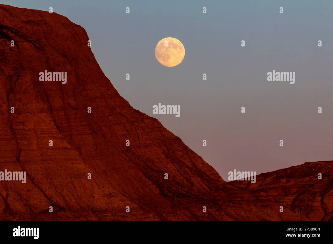 Breathtaking view of full moon. Multi-colored Bay, Gobi desert ...